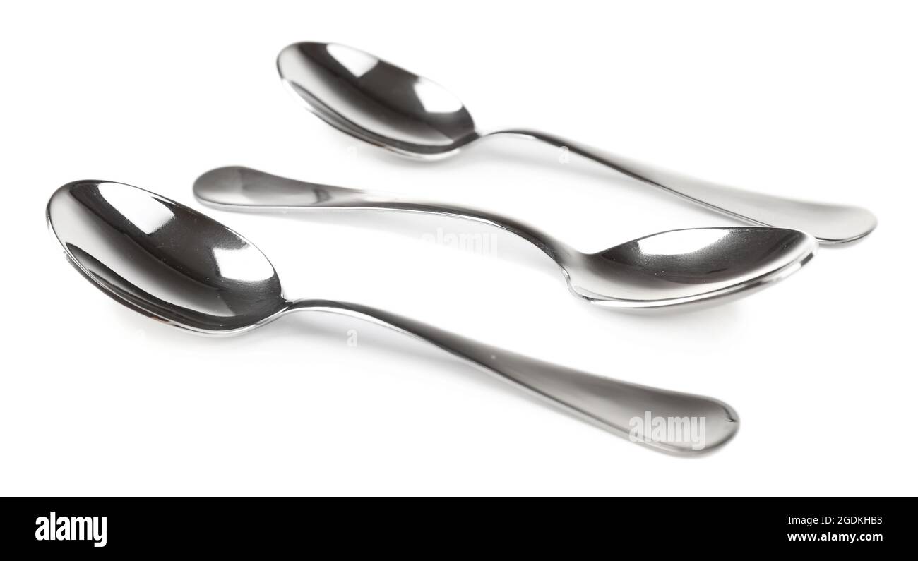Metal tea spoon isolated on white Stock Photo - Alamy