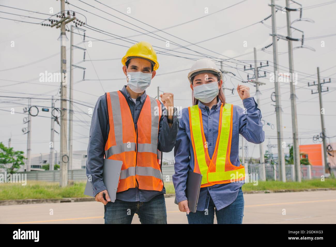 Team work engineer wear face mask out side working inspection or survey ...
