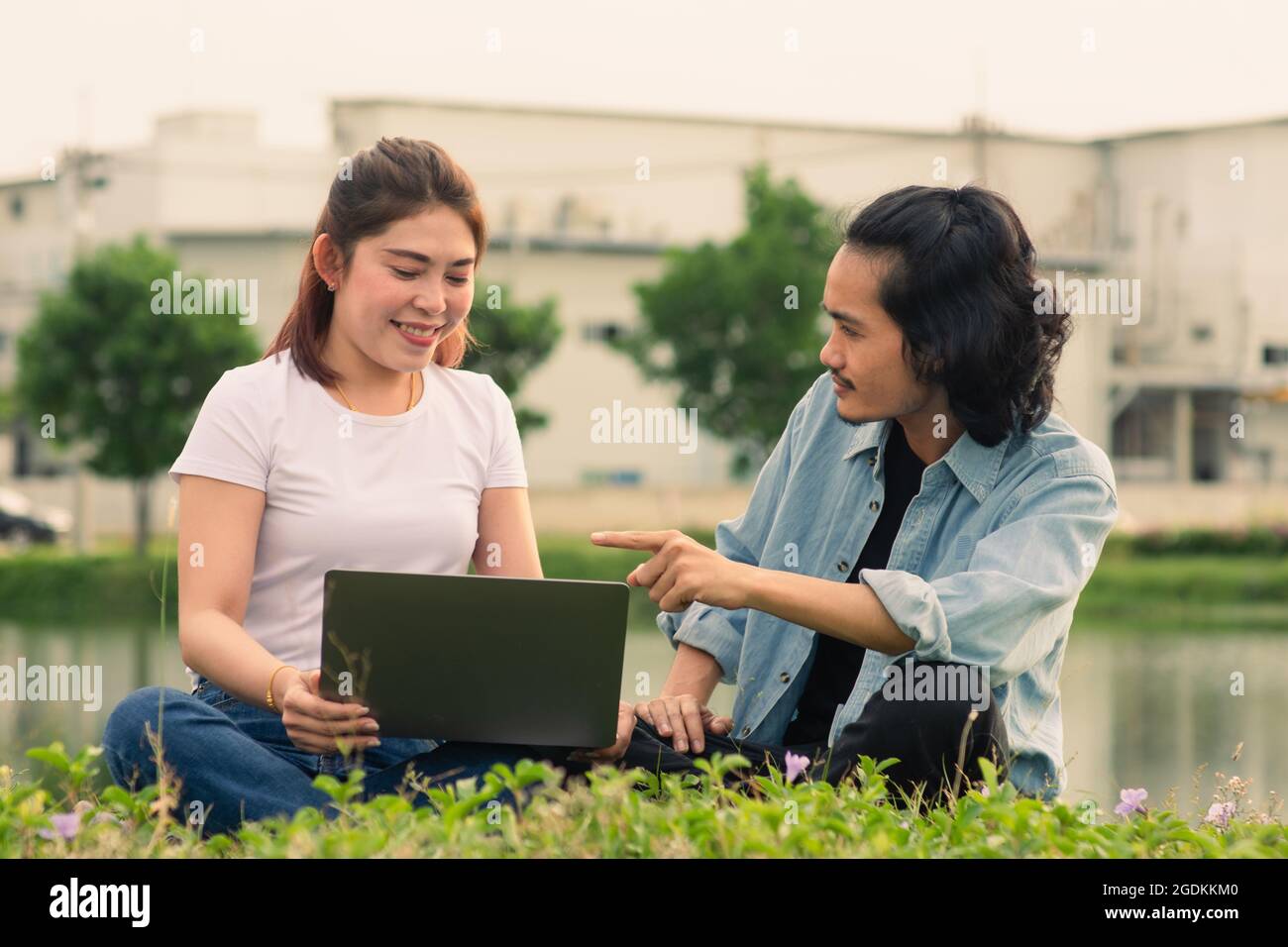 Asian people friends using computer laptop outdoor summer in university ...