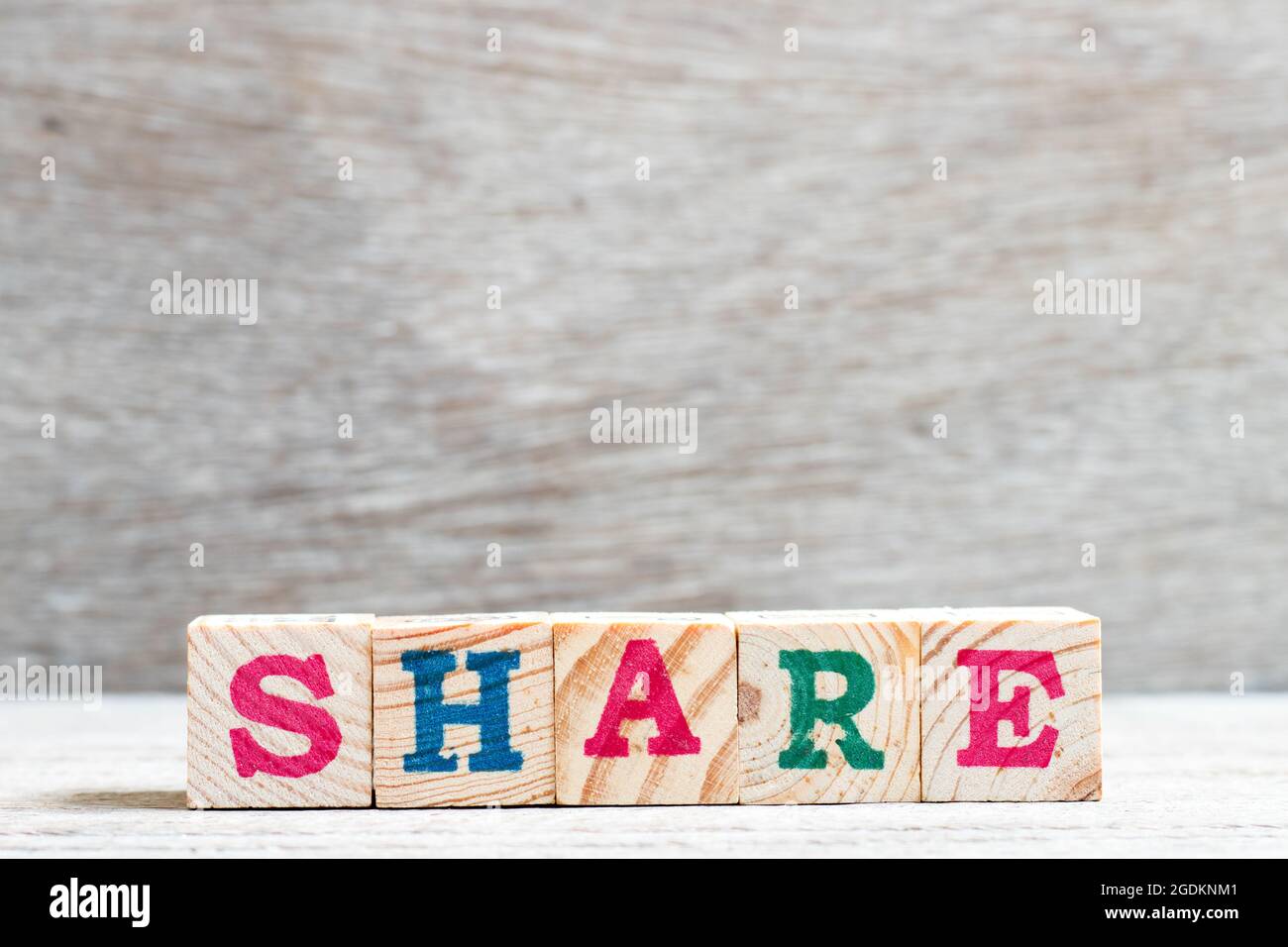 Letter block in word share on wood background Stock Photo - Alamy