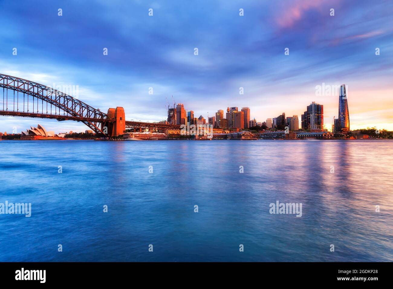 Cloudy sunset over skyline of Sydney city CBD high-rise towers with ...