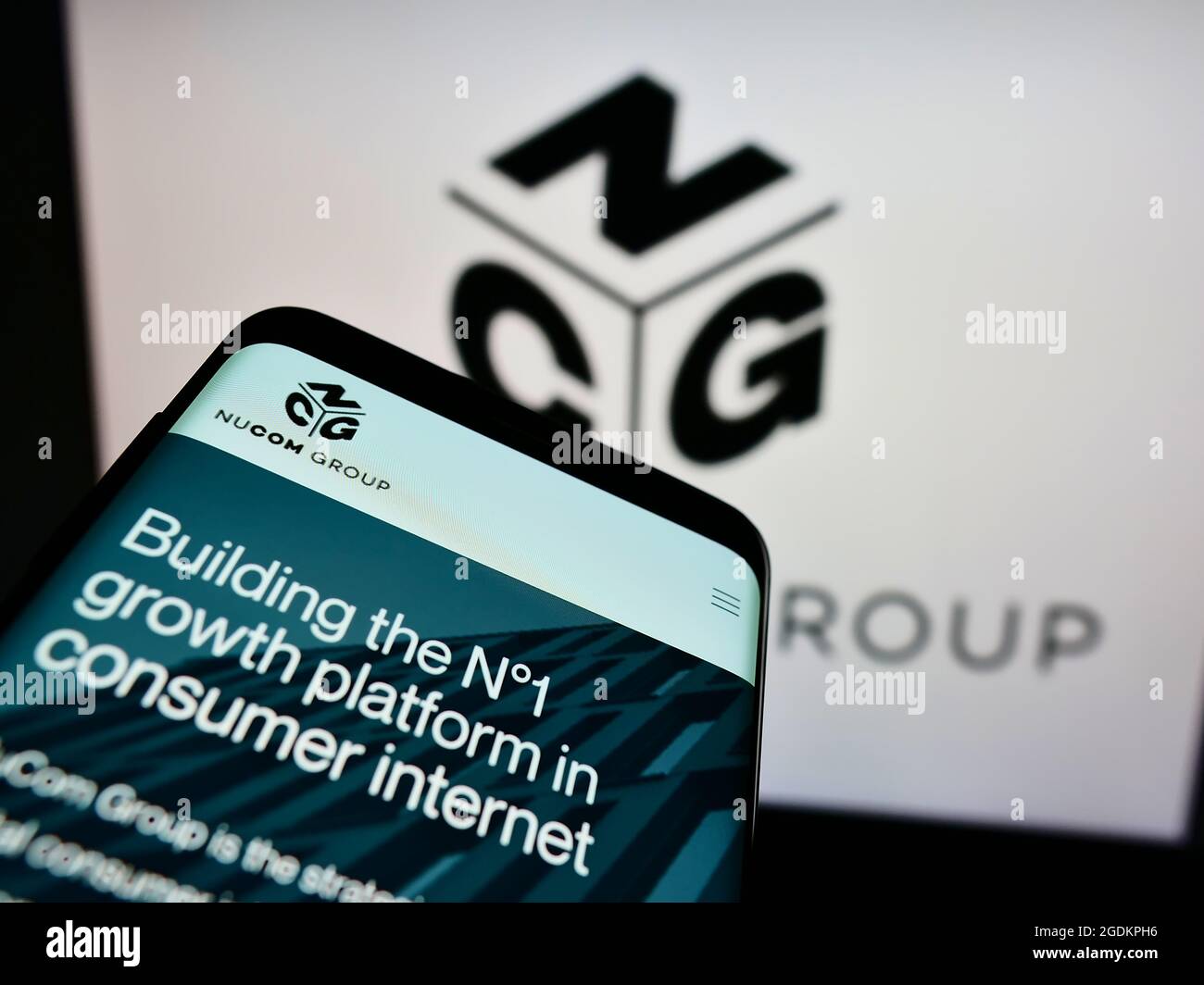 Smartphone with website of German holding company NCG NuCom Group SE on ...