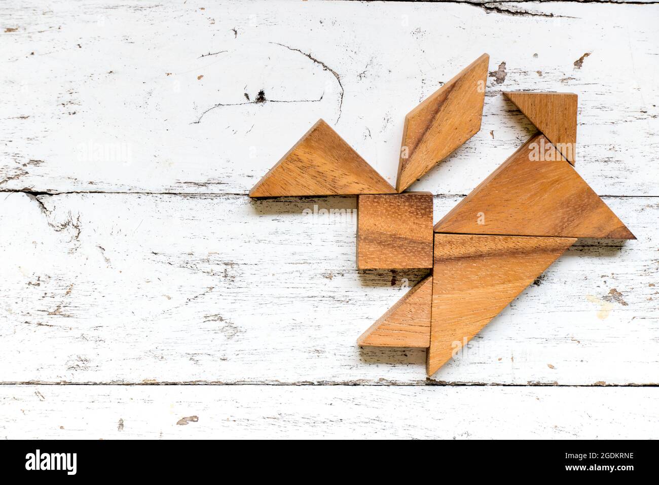 Tangram puzzle in rabbit shape on old white wood background Stock Photo ...