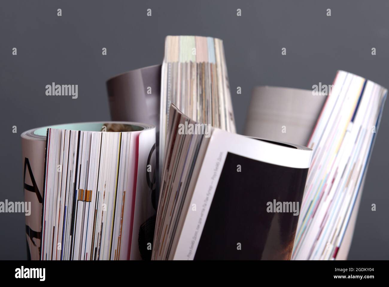 Magazines on gray background Stock Photo - Alamy