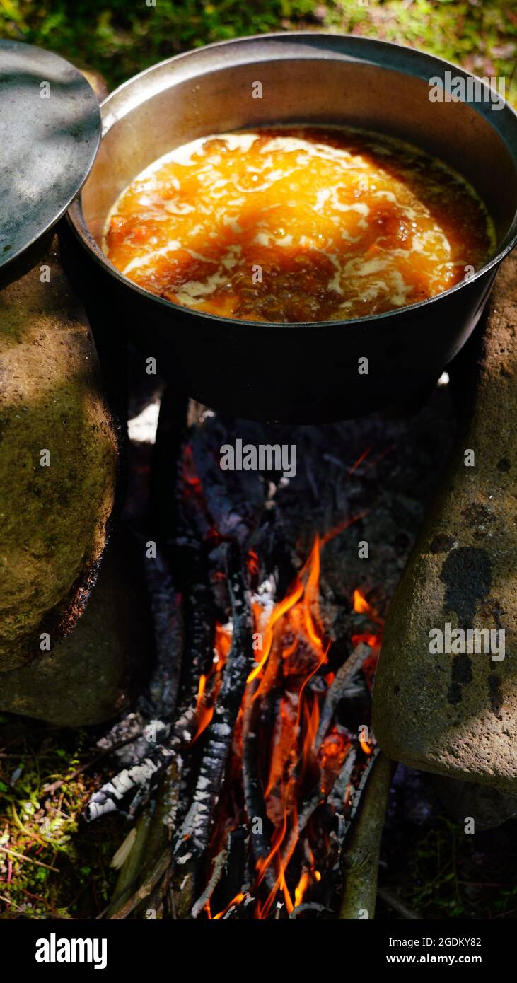 cooking lamb pilaf on a fire Stock Photo - Alamy