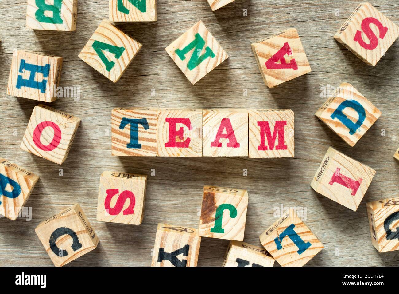 Letter block in word team with another on wood background Stock Photo ...