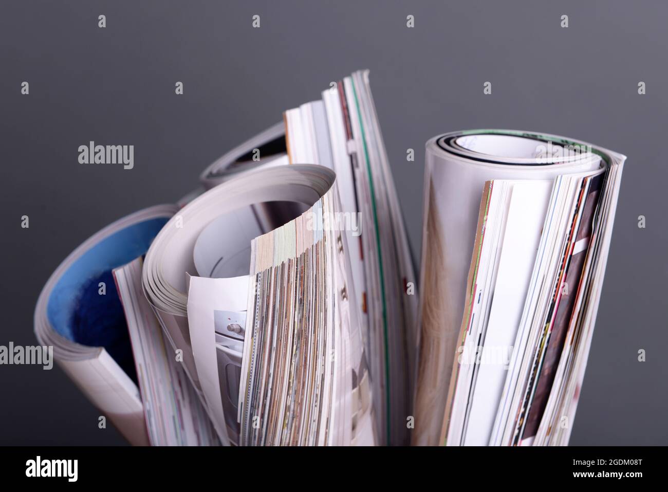 Magazines on gray background Stock Photo - Alamy
