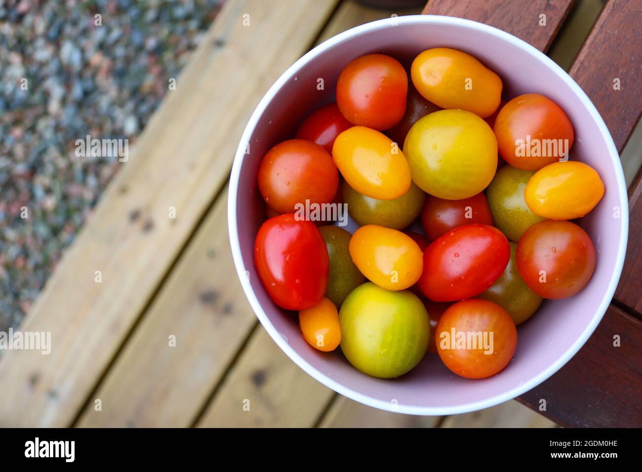 Cherry tomatoes in different colors in a bowl Stock Photo - Alamy