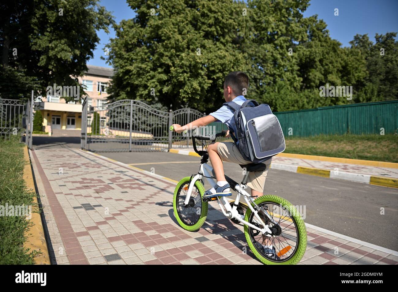 Back view boy on bicycle hi-res stock photography and images - Alamy
