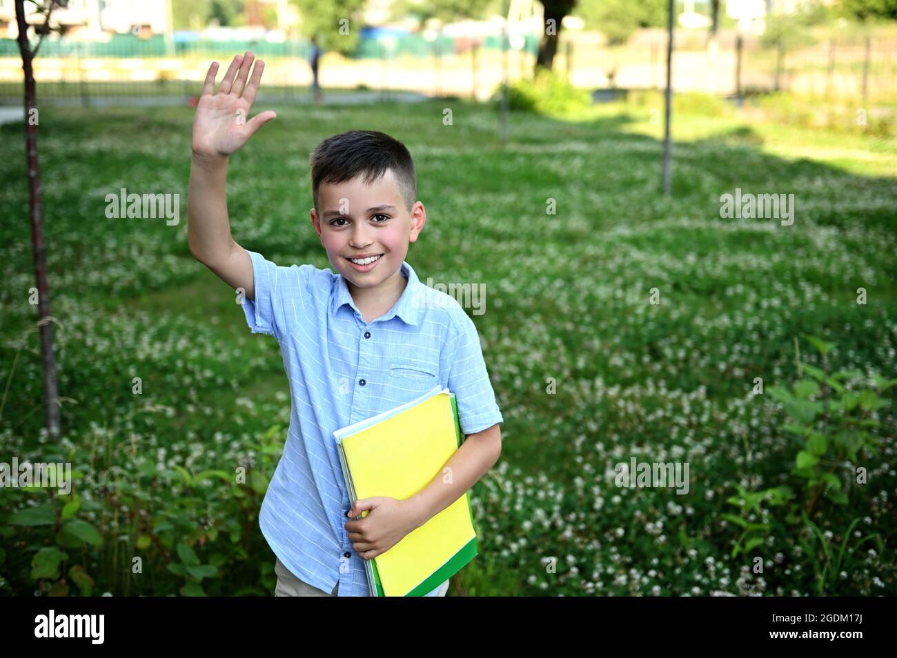 Happy elementary student, pupil, coming back to school. Adorable ...