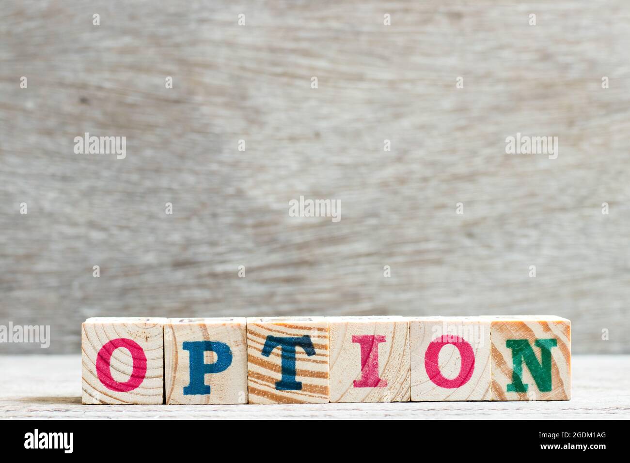 Letter block in word option on wood background Stock Photo - Alamy