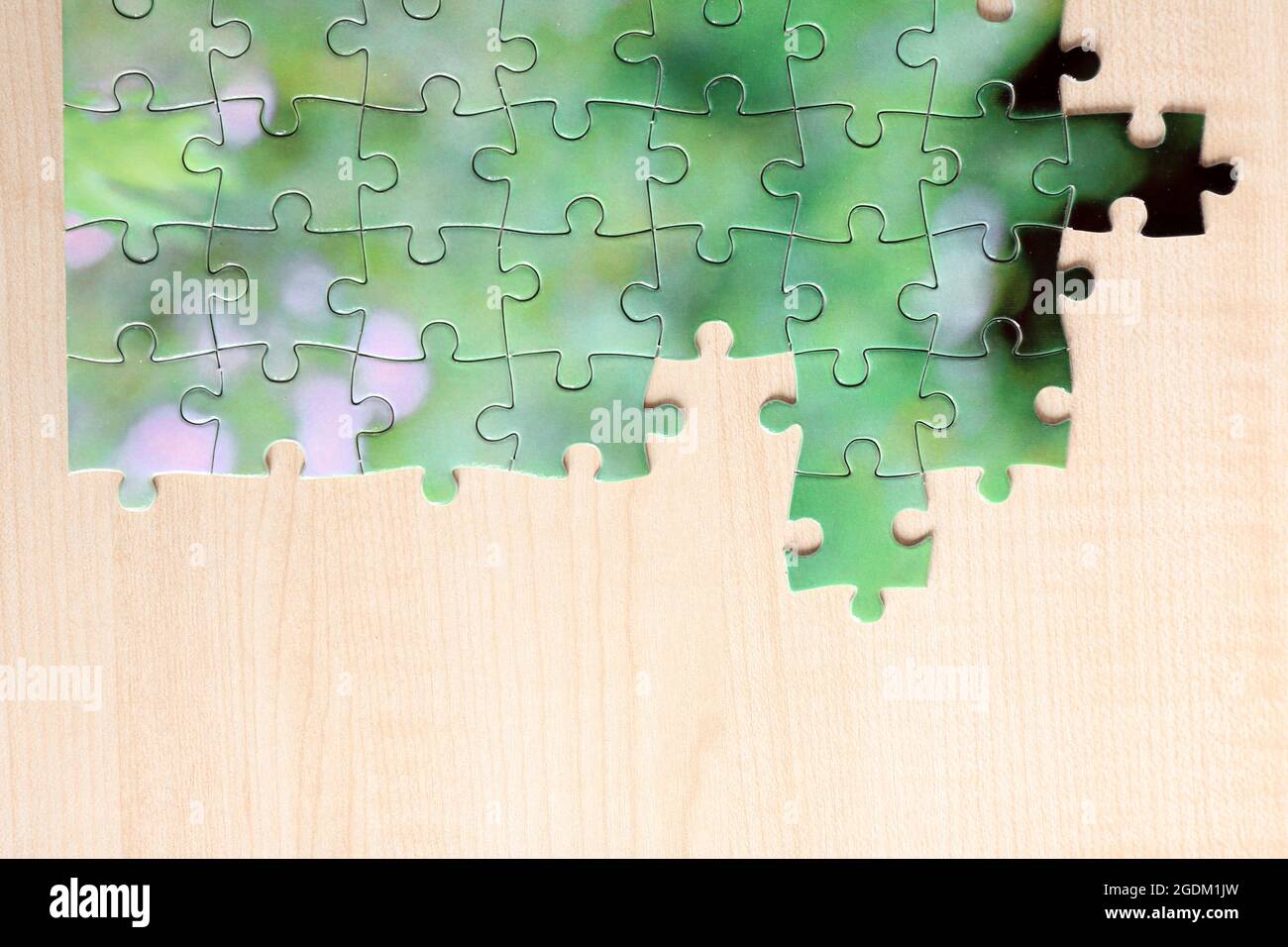 Puzzles with beautiful landscape on wooden background Stock Photo - Alamy