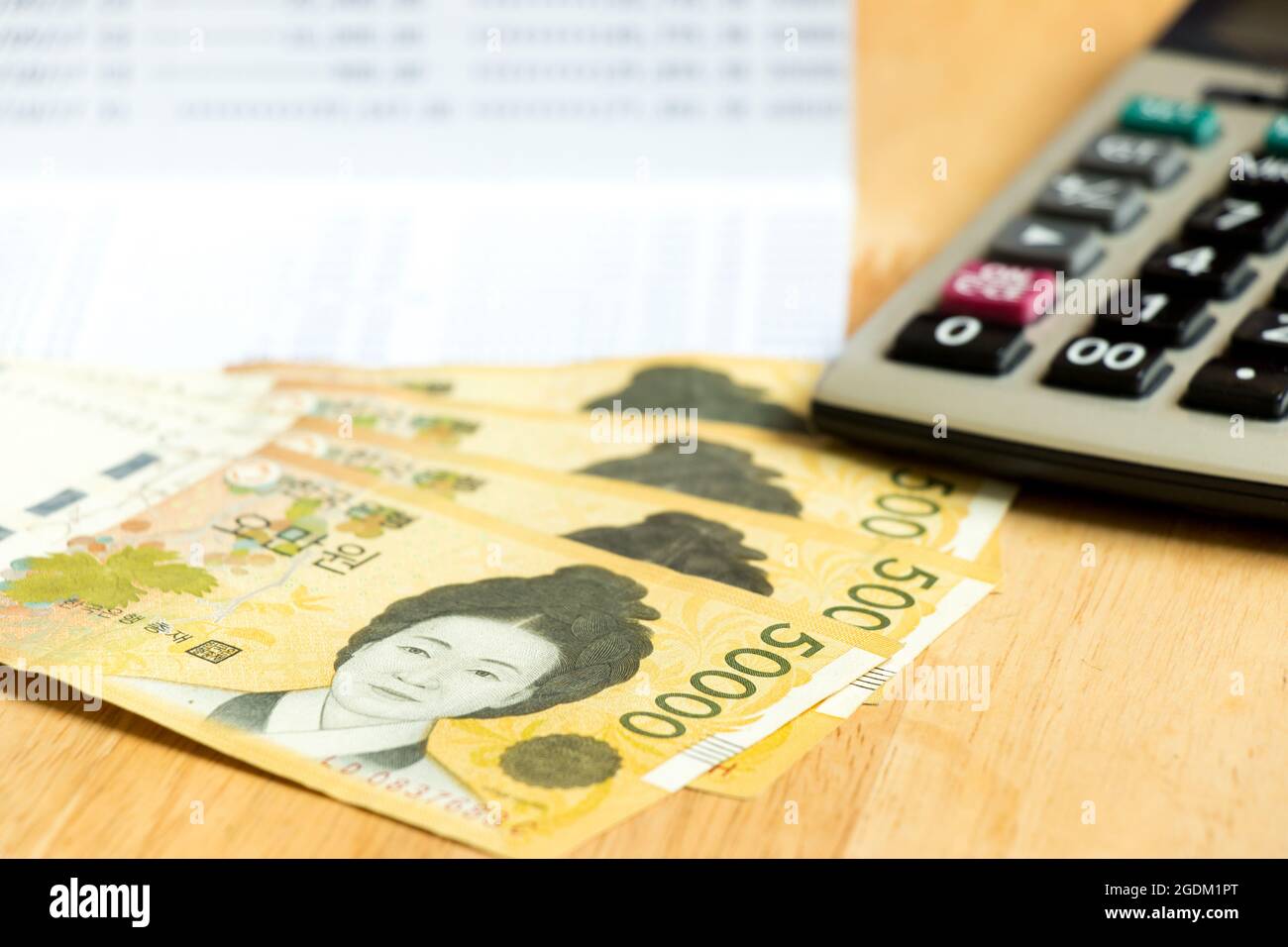 Bank book, calculator and south korea won (krw) banknote on wood table ...