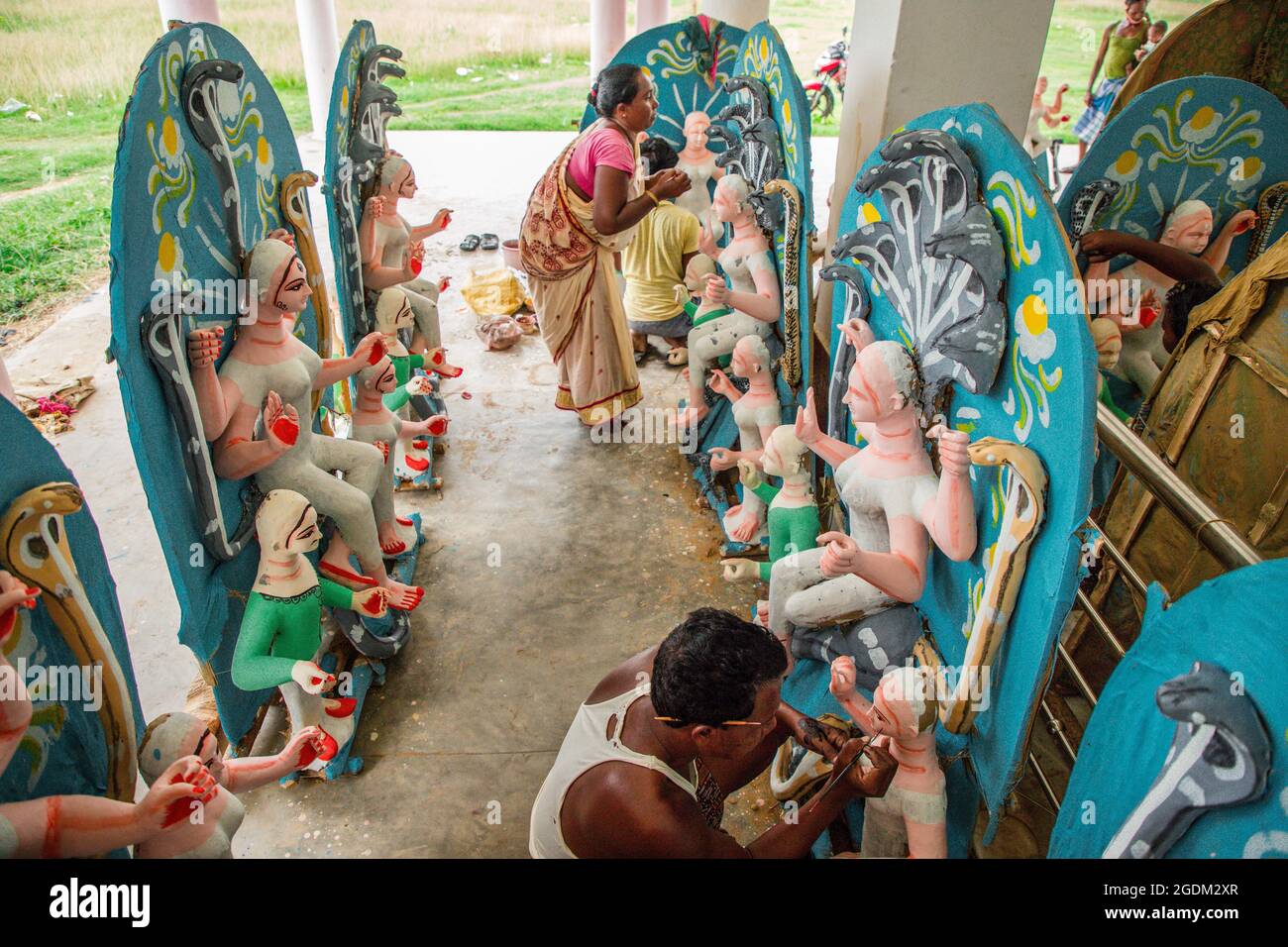 East Singhbhum, India. 13th Aug, 2021. Artist preparing clay idols of ...