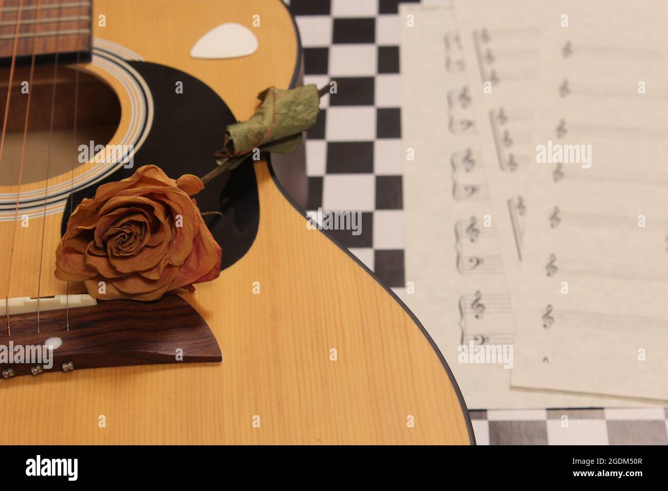 Classic Acoustic Guitar With Dried Roses Stock Photo - Alamy