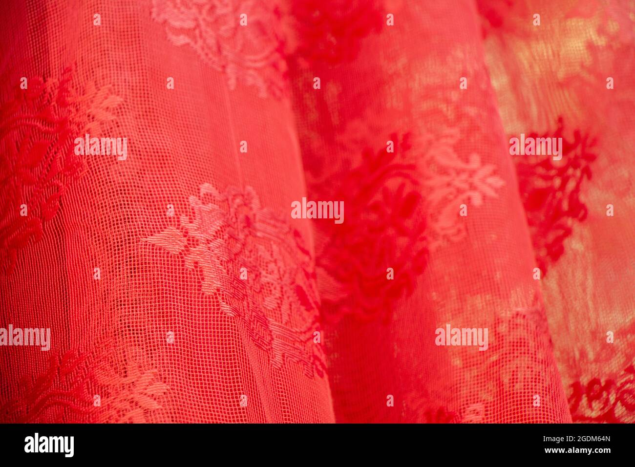 Closeup of red fabric with intricate embroidery - background of red ...