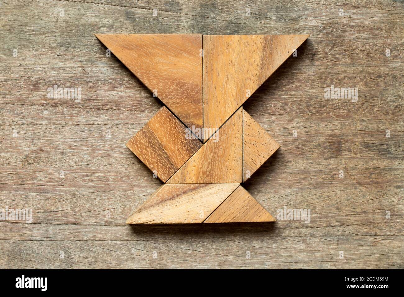 Tangram puzzle in vase or jar shape on wood background Stock Photo - Alamy