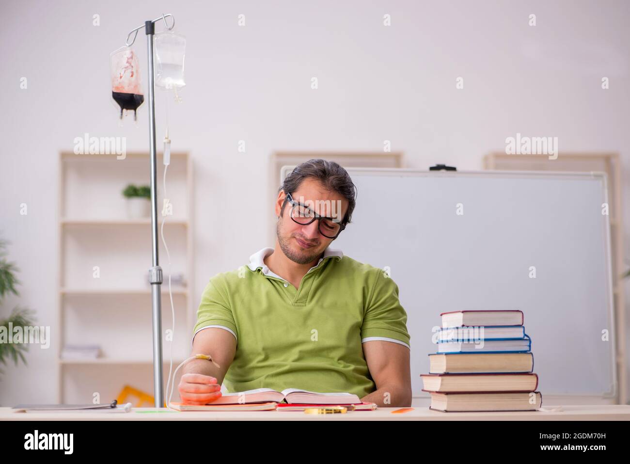 Young sick teacher student in blood transfusion concept Stock Photo - Alamy