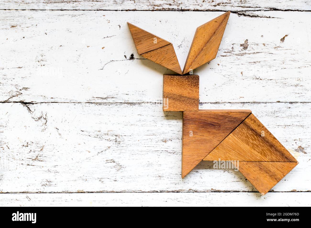 Tangram puzzle in rabbit shape on old white wood background Stock Photo ...