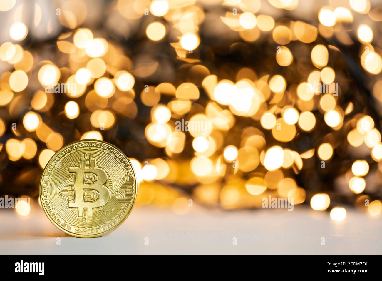 Golden bitcoin with yellow bokeh background. Cryptocurrency concept ...