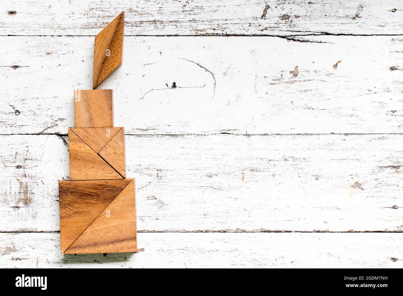 Tangram puzzle in candle shape on old white wood background Stock Photo ...