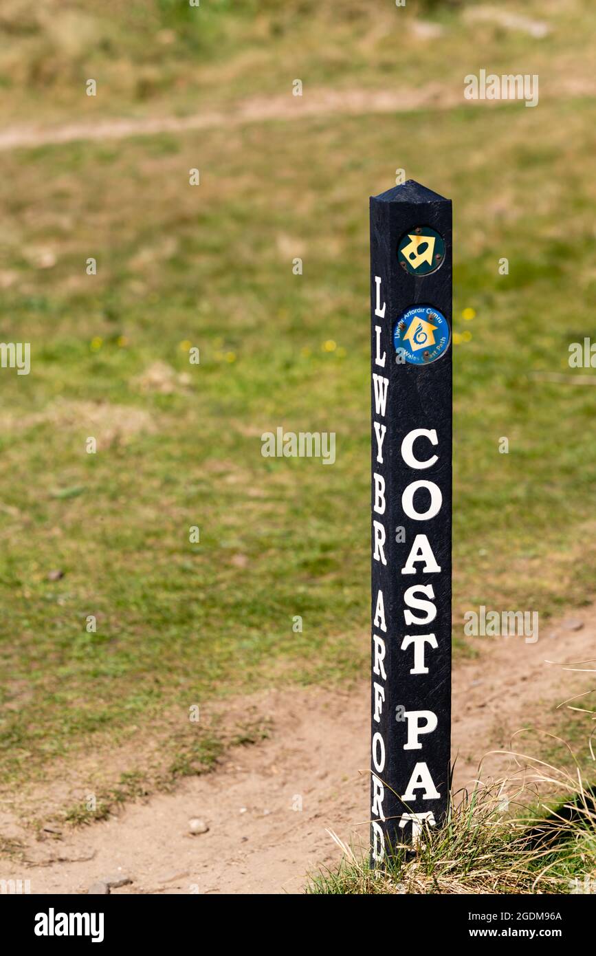 Direction sign for the Wales Costal Path in English and Welsh Stock ...