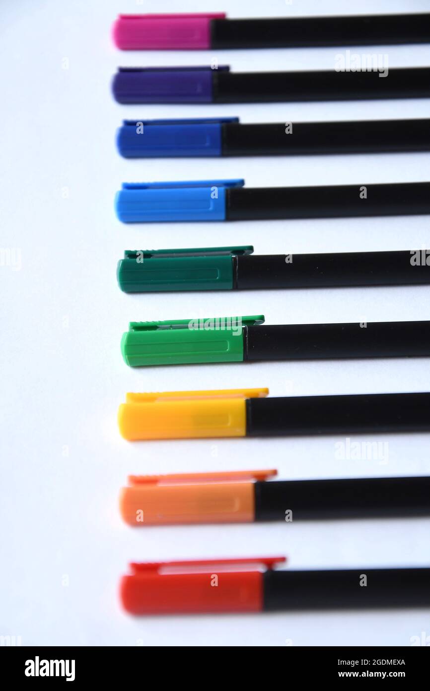 Photo of colorful pens on white background Stock Photo - Alamy