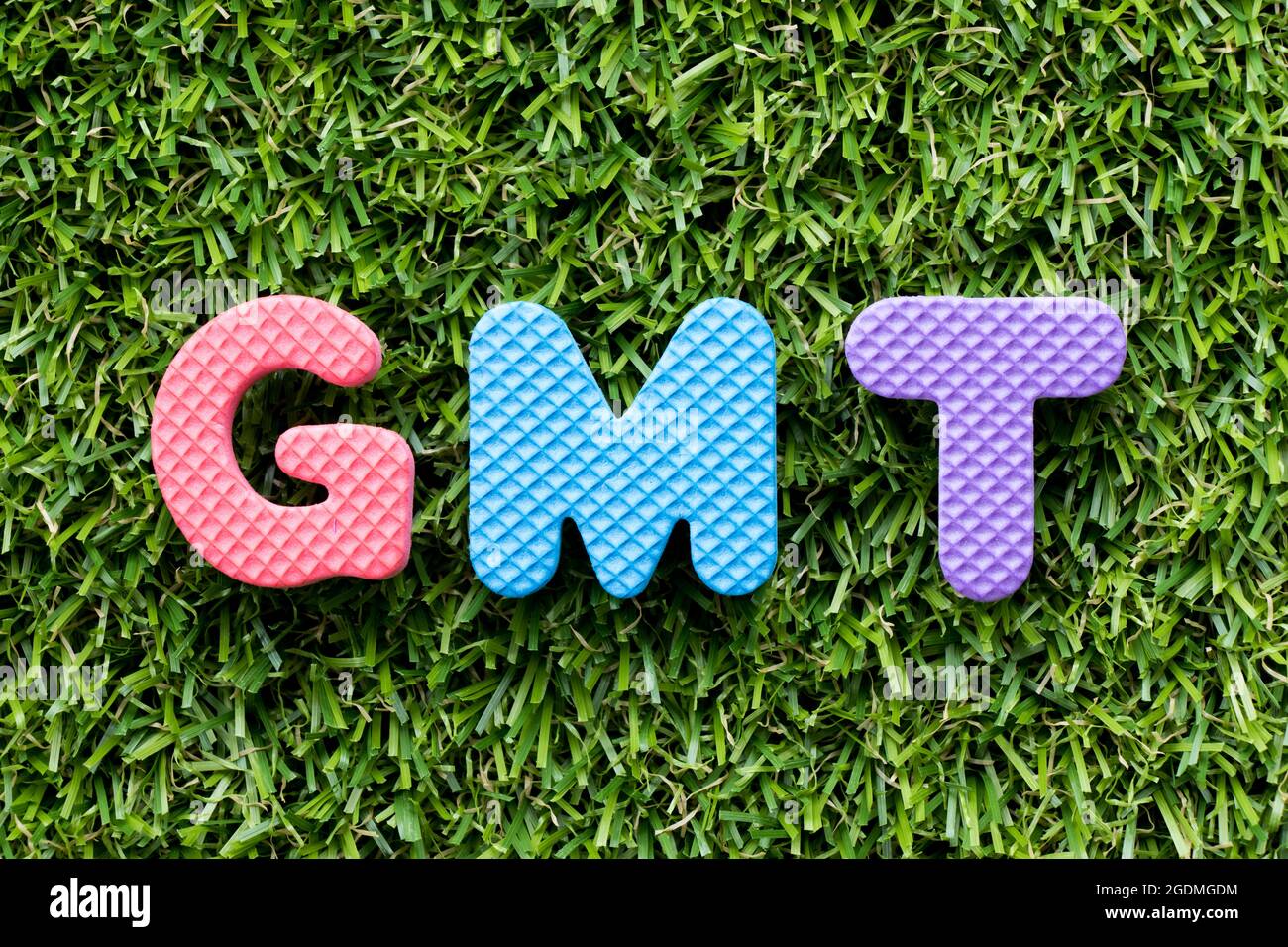 Color alphabet letter in word GMT (abbreviation of Greenwich Mean Time ...