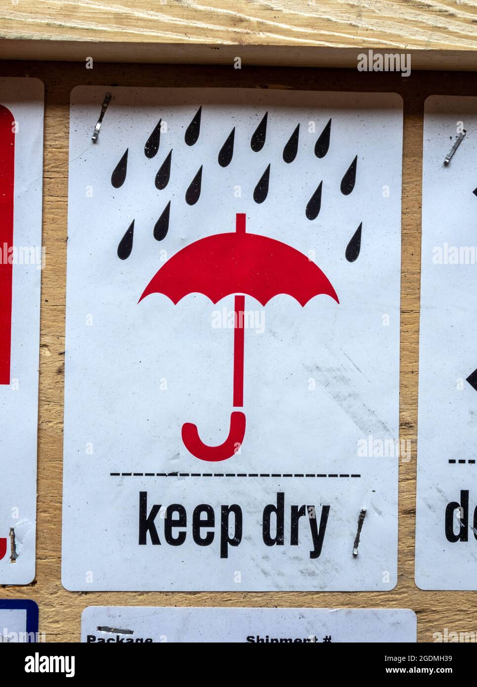 Keep-dry symbol information label beside transportation wooden box ...