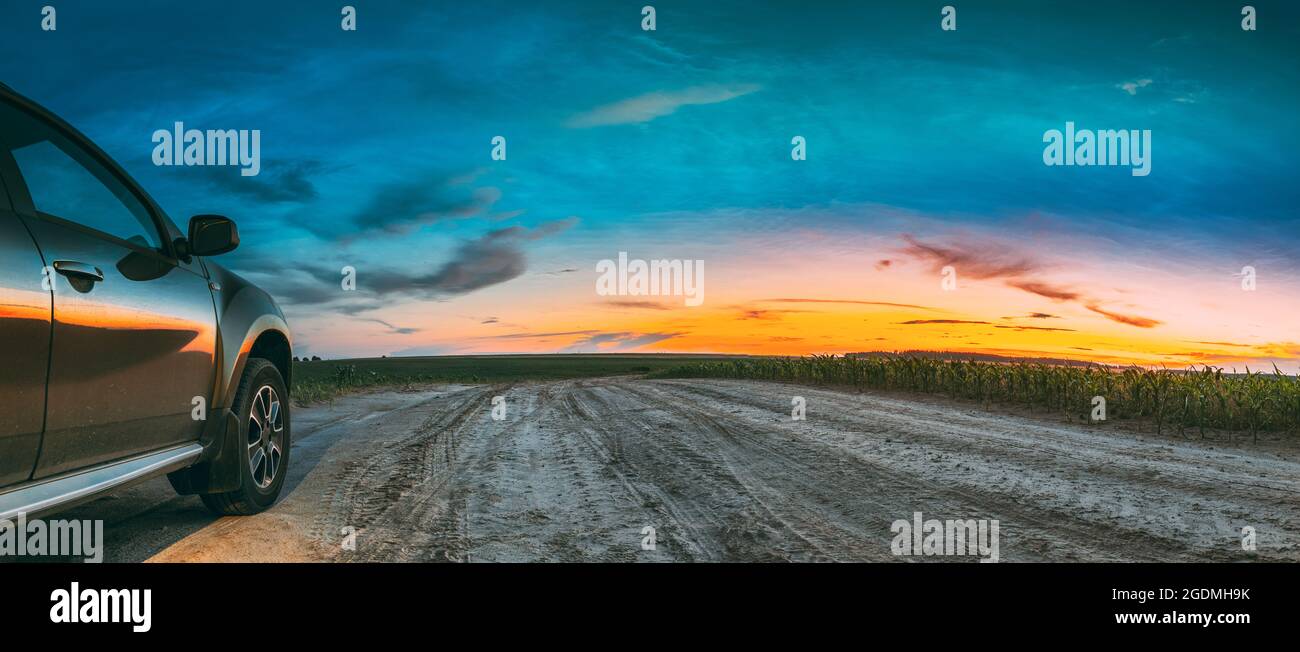 Green SUV Car Parked On Field Country Road Through Summer Maize Field ...
