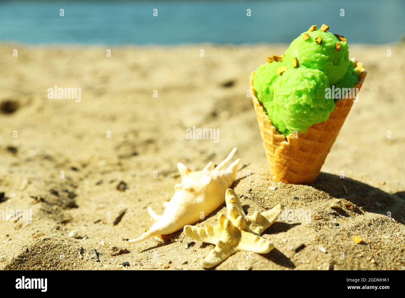 Ice cream in sand on beach Stock Photo - Alamy