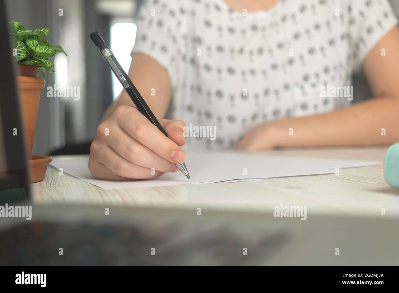 Female hands with pen writing on document. Office desk workspace ...