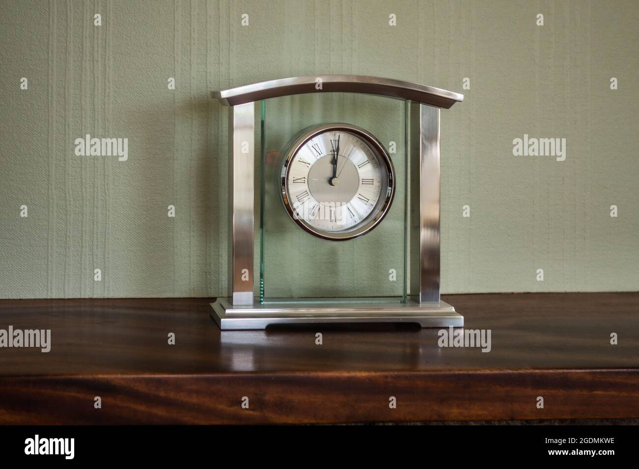 Glass fronted mounted battery mantle clock circa 1980's Stock Photo - Alamy