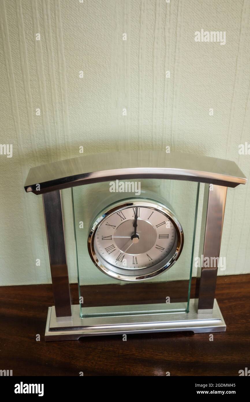 Glass fronted mounted battery mantle clock circa 1980's Stock Photo - Alamy