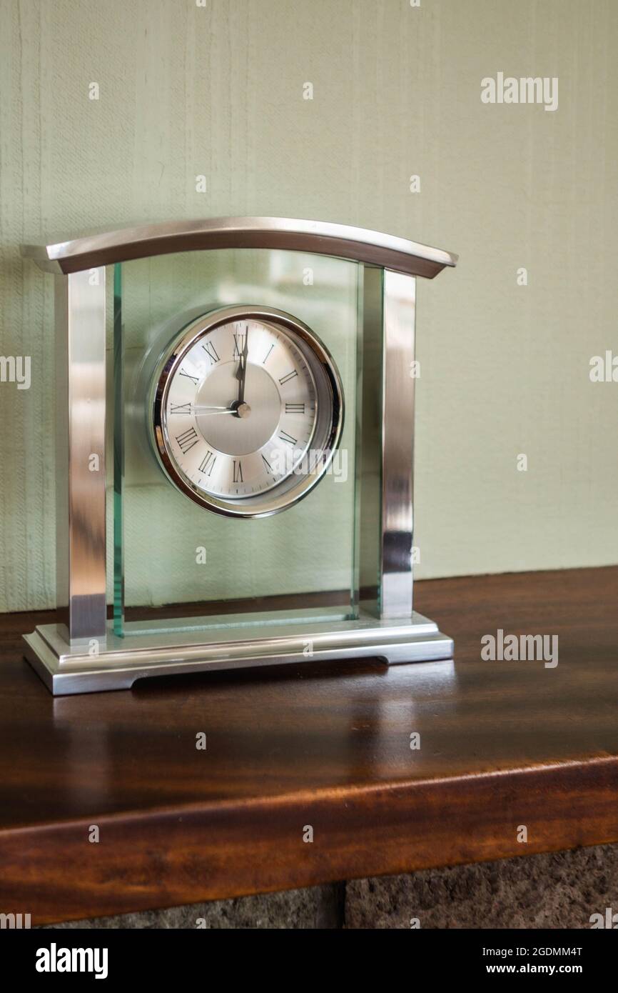Glass fronted mounted battery mantle clock circa 1980's Stock Photo - Alamy