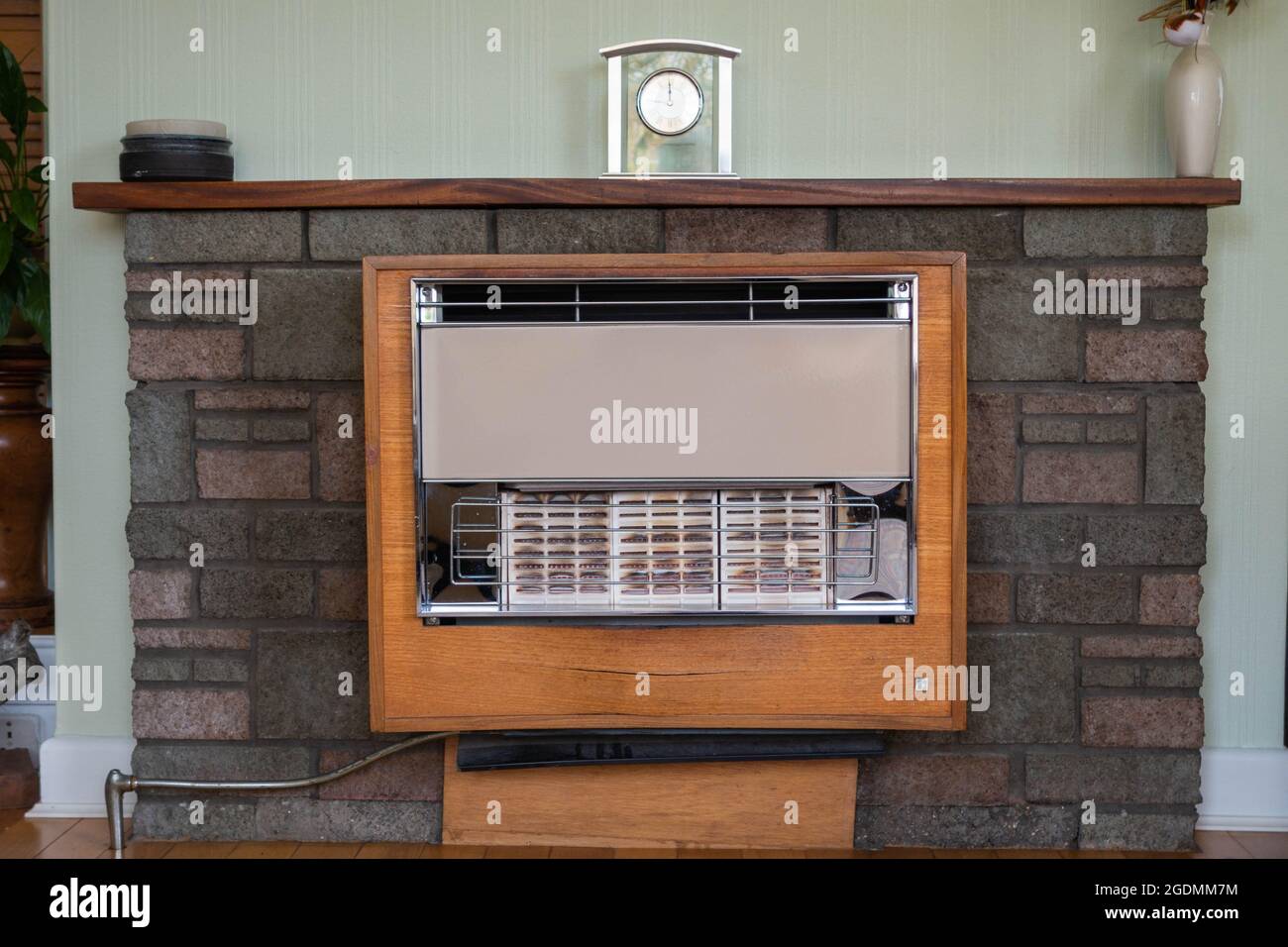1980's traditional wood surround gas fire built into stone fireplace ...