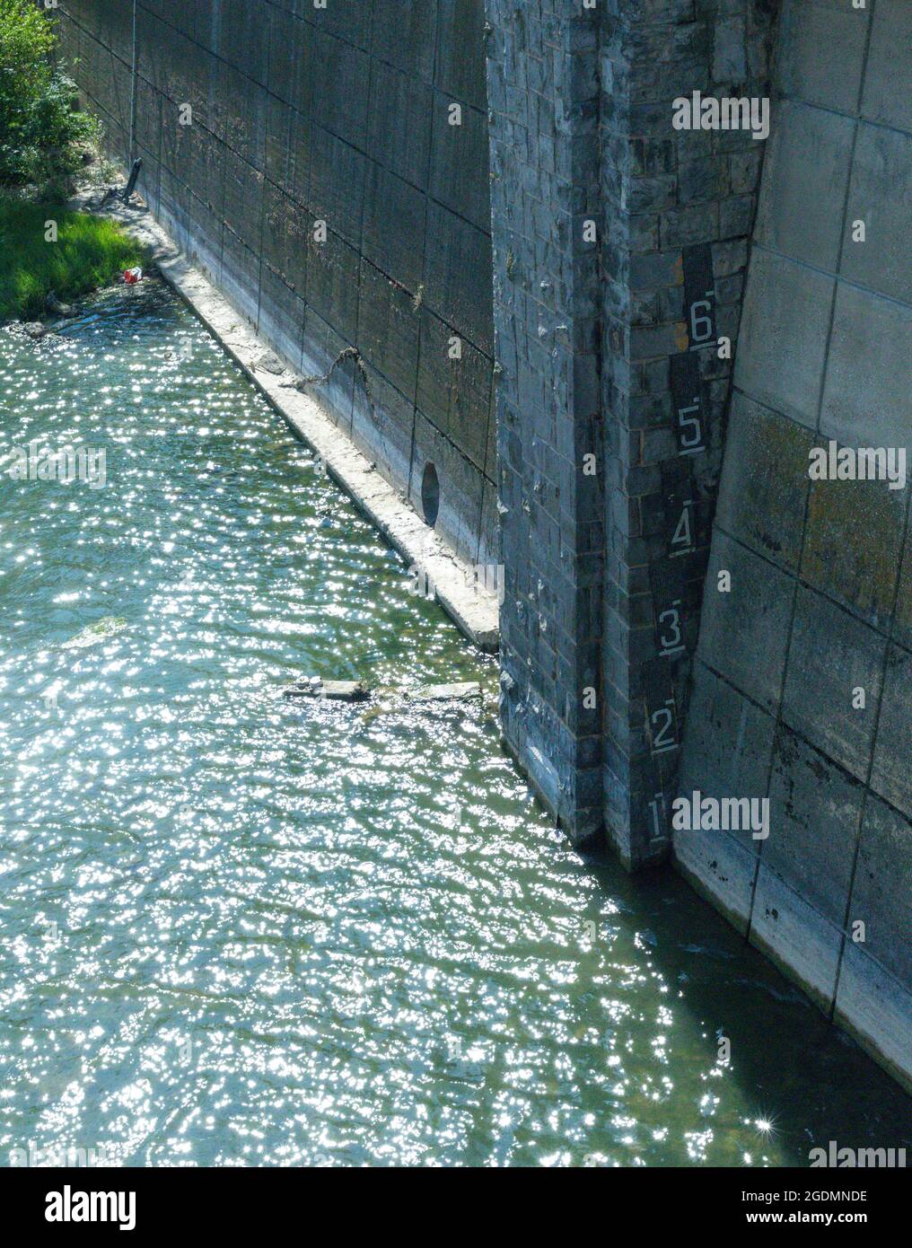 level indicator with numbers of the water capacity of the flow of a ...