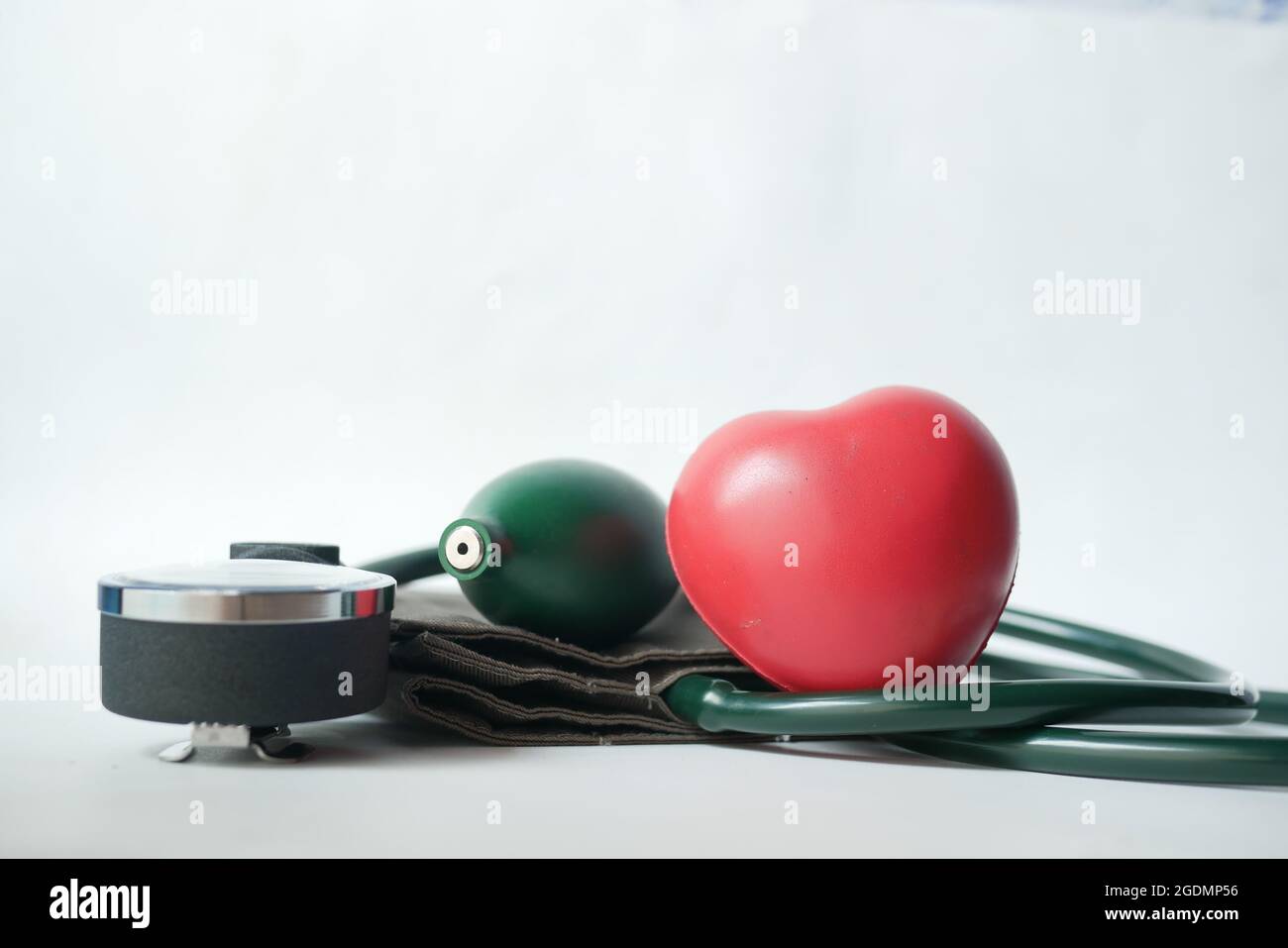 blood pressure machine and heart shape on white background Stock Photo ...