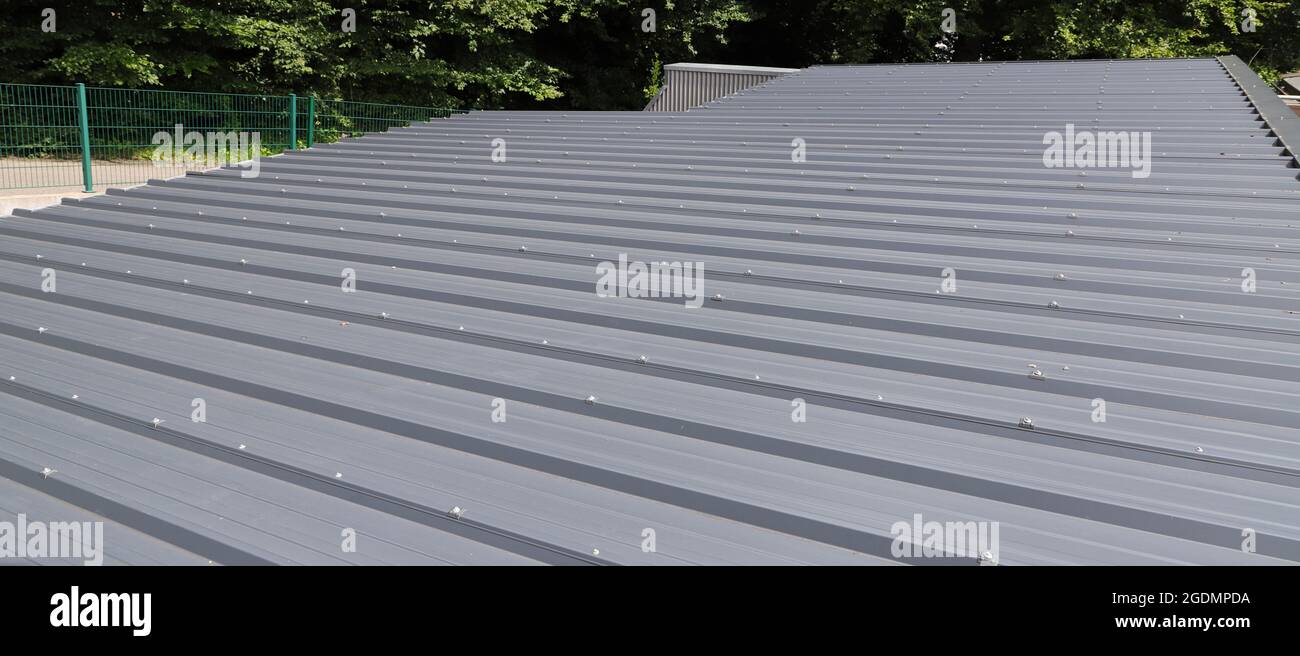 a roof with gray trapezoidal sheet metal Stock Photo - Alamy