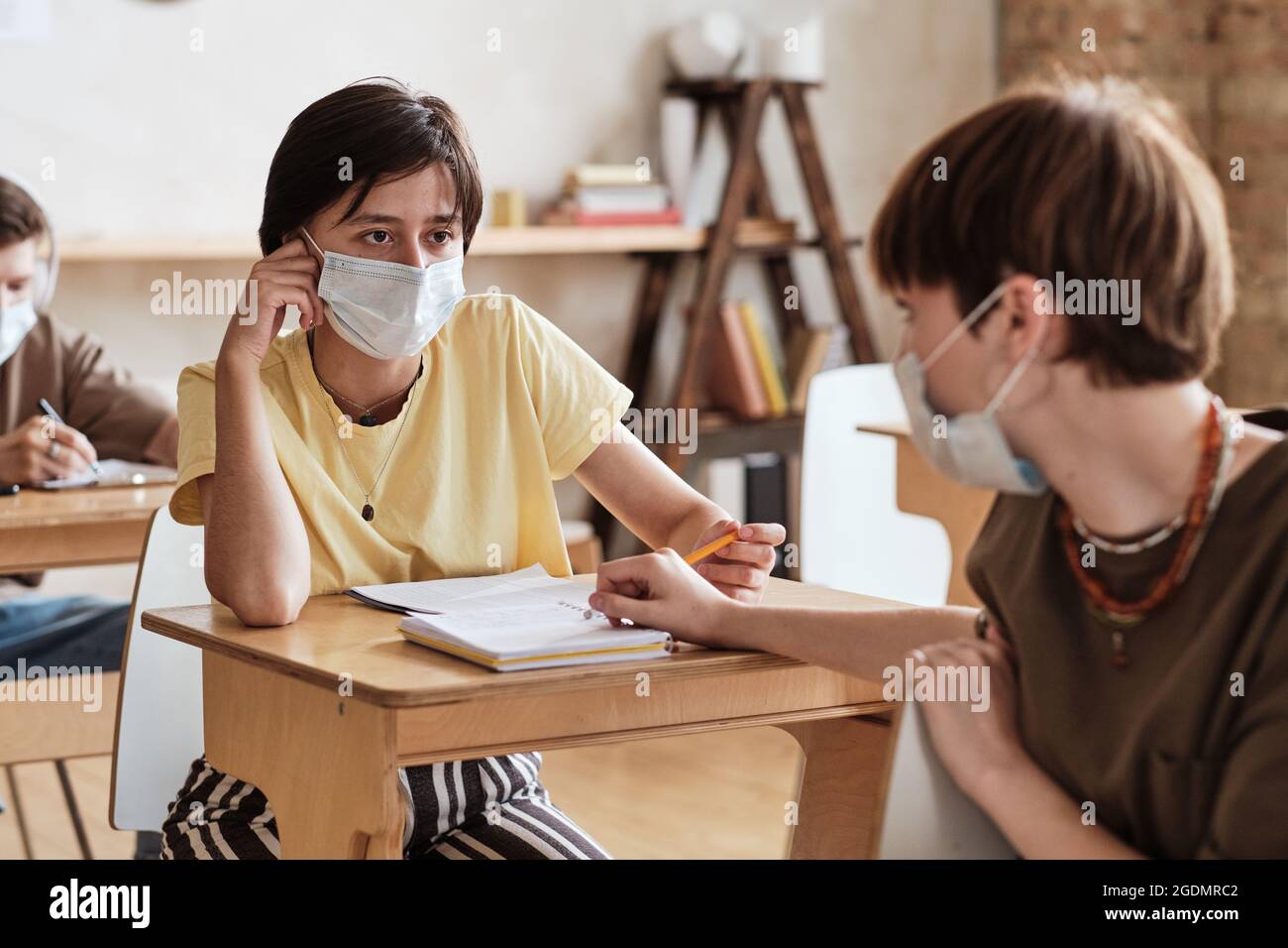 Two boys talking classroom hi-res stock photography and images - Alamy