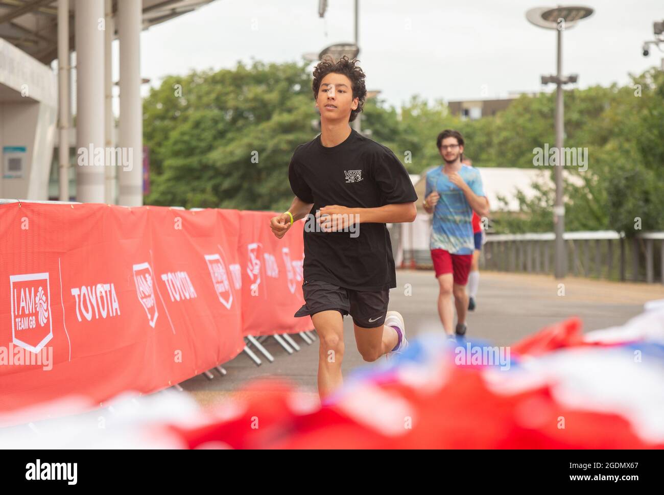 A young boy crosses the finish line of the Lap of Honour during the I ...