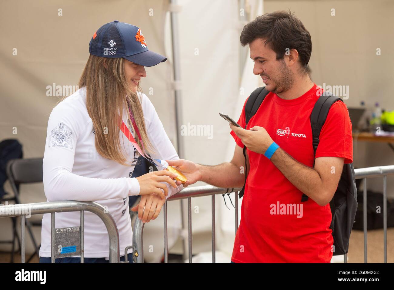Great Britain's Charlotte Worthington (left) shows off her gold medal ...