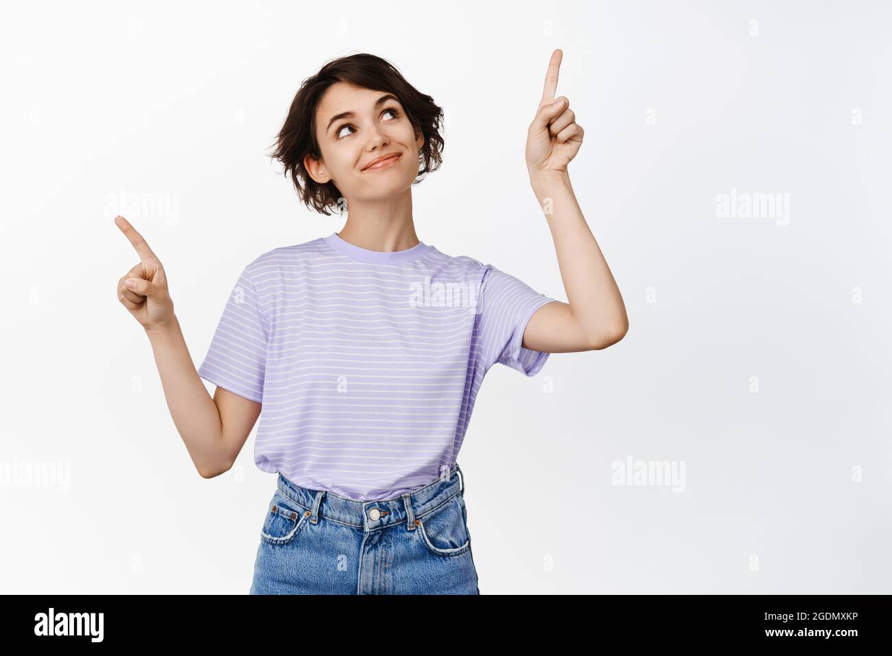 Thoughtful smiling girl shopper, female client picking between two ...