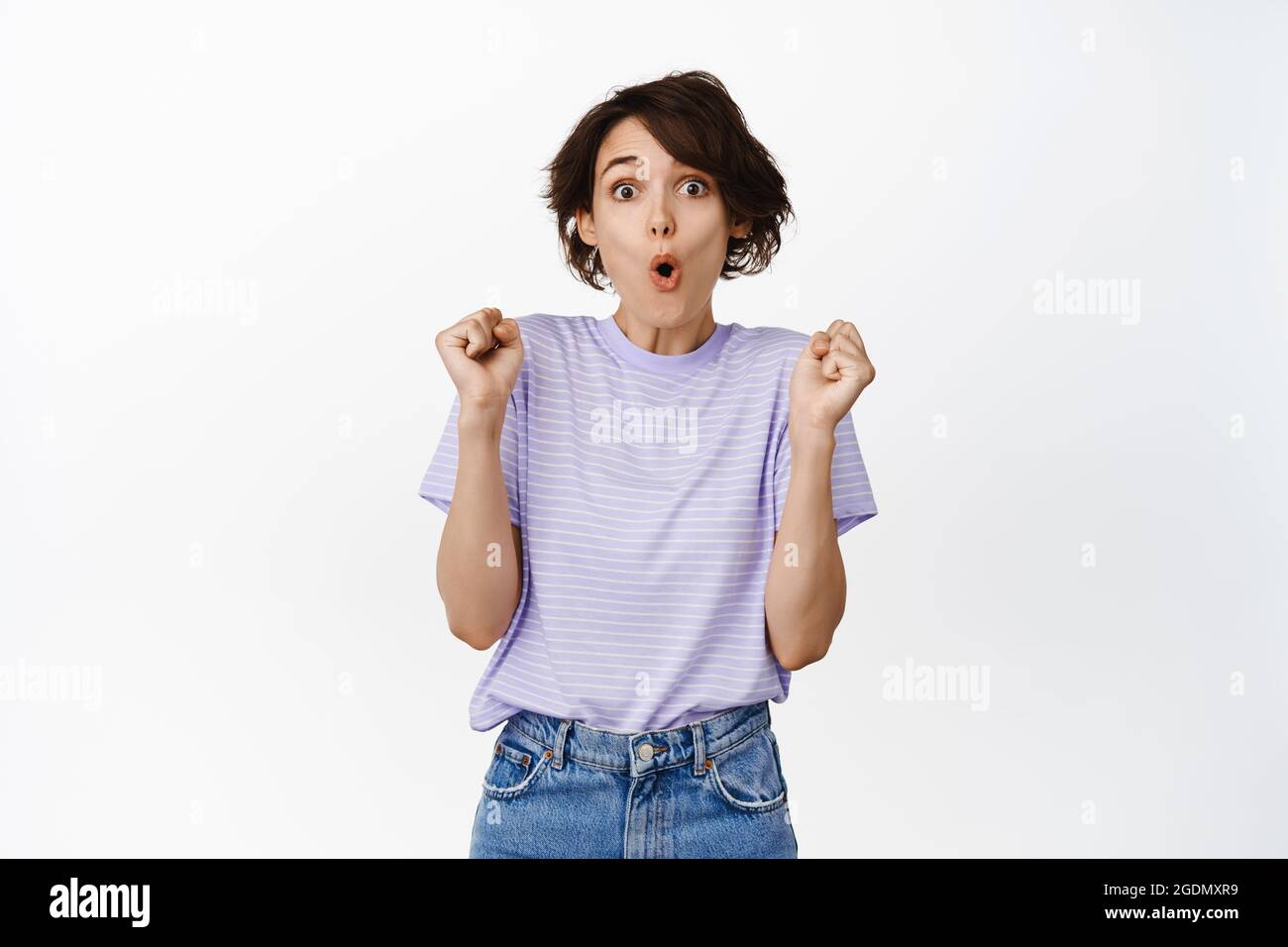 Portrait of cute surprised girl look excited and speechless, in awe ...