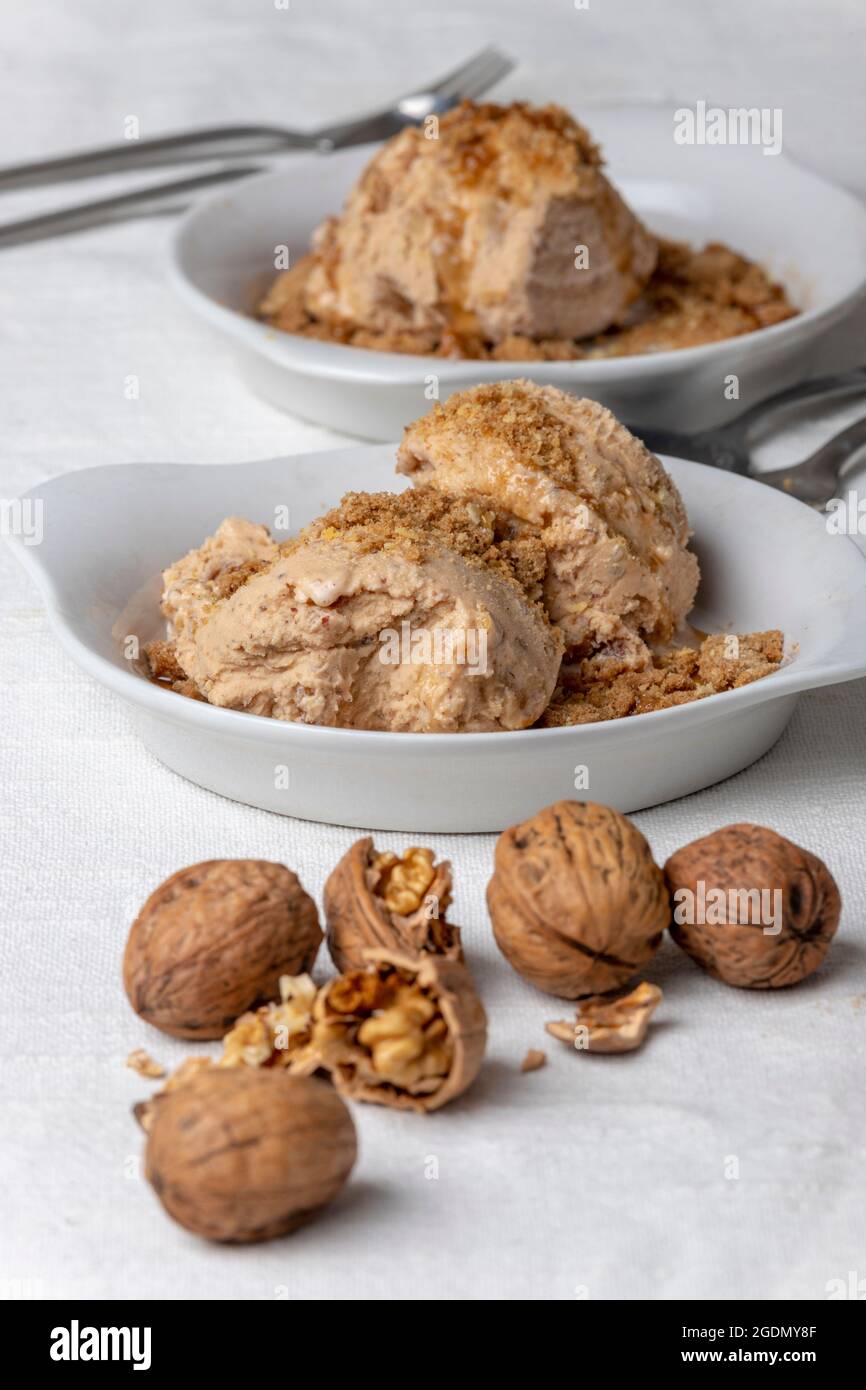 two portions of walnut ice cream Stock Photo - Alamy