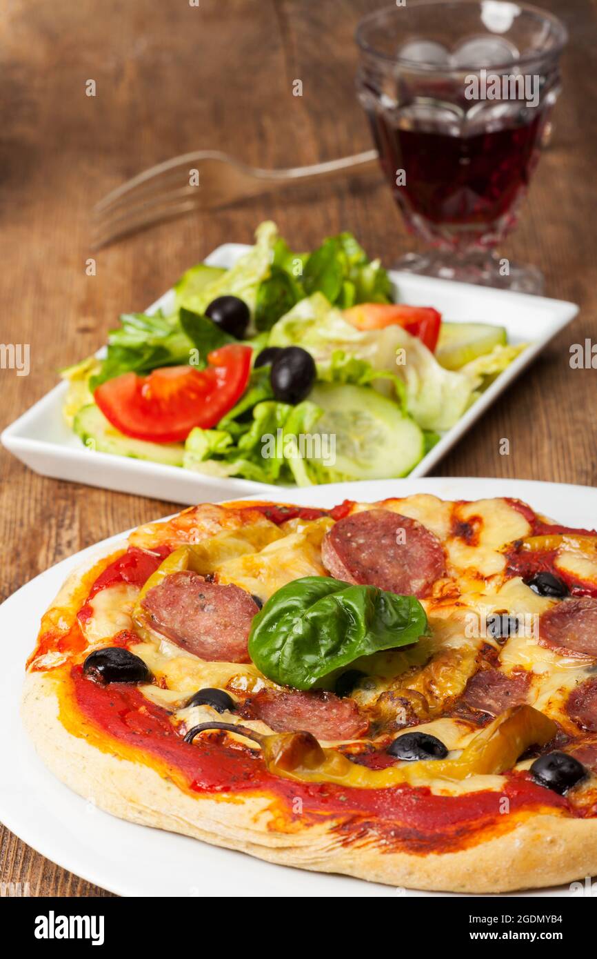closeup of a pizza with a basil leaf Stock Photo - Alamy