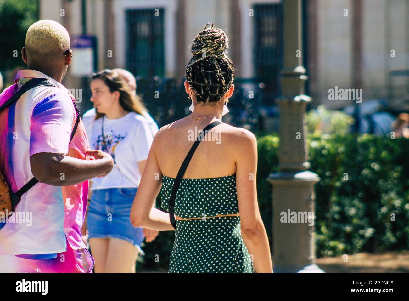 Seville Spain August 11, 2021 Tourists walking in the street of Seville ...