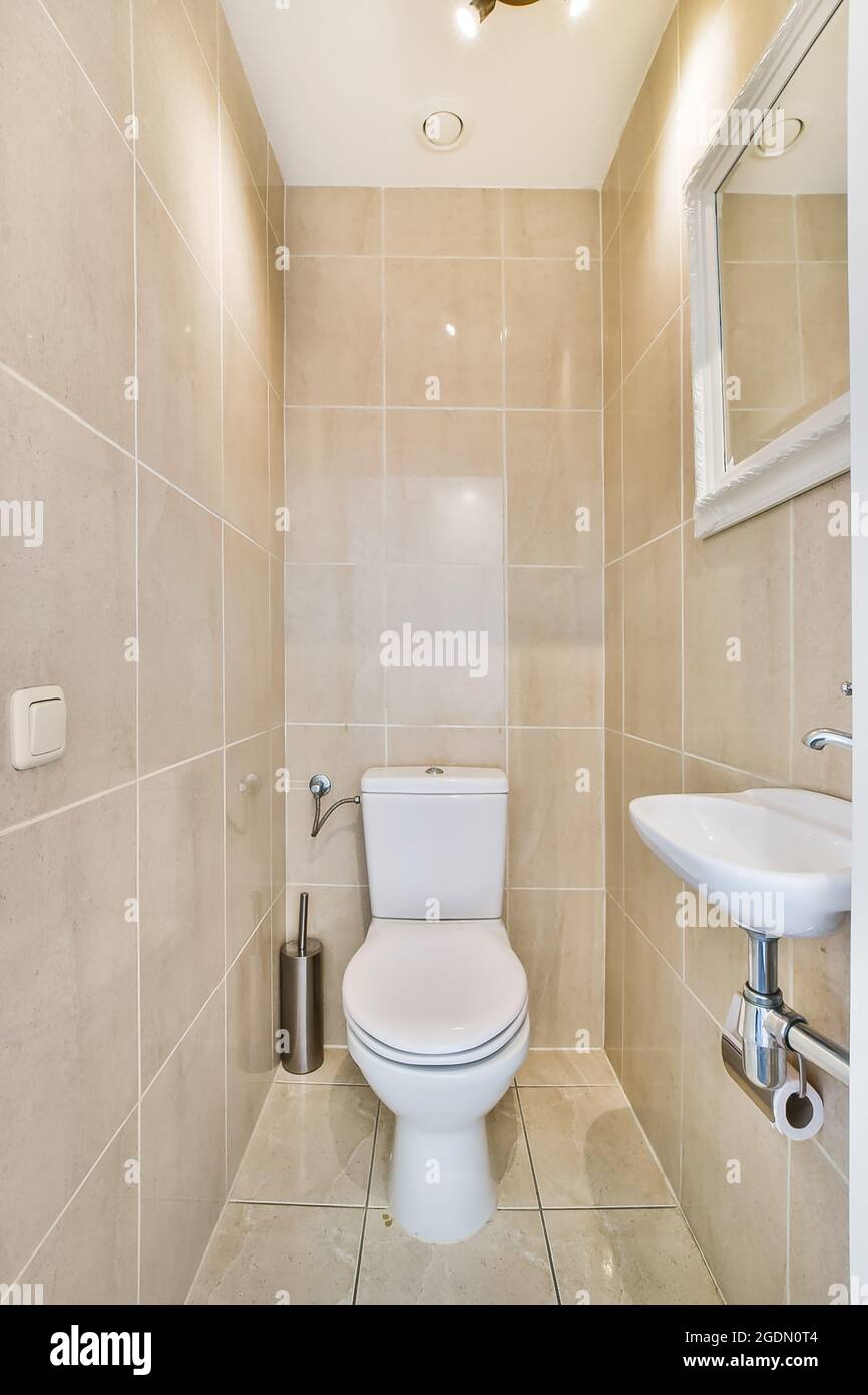 Interior of small clean washroom in miniature style Stock Photo - Alamy