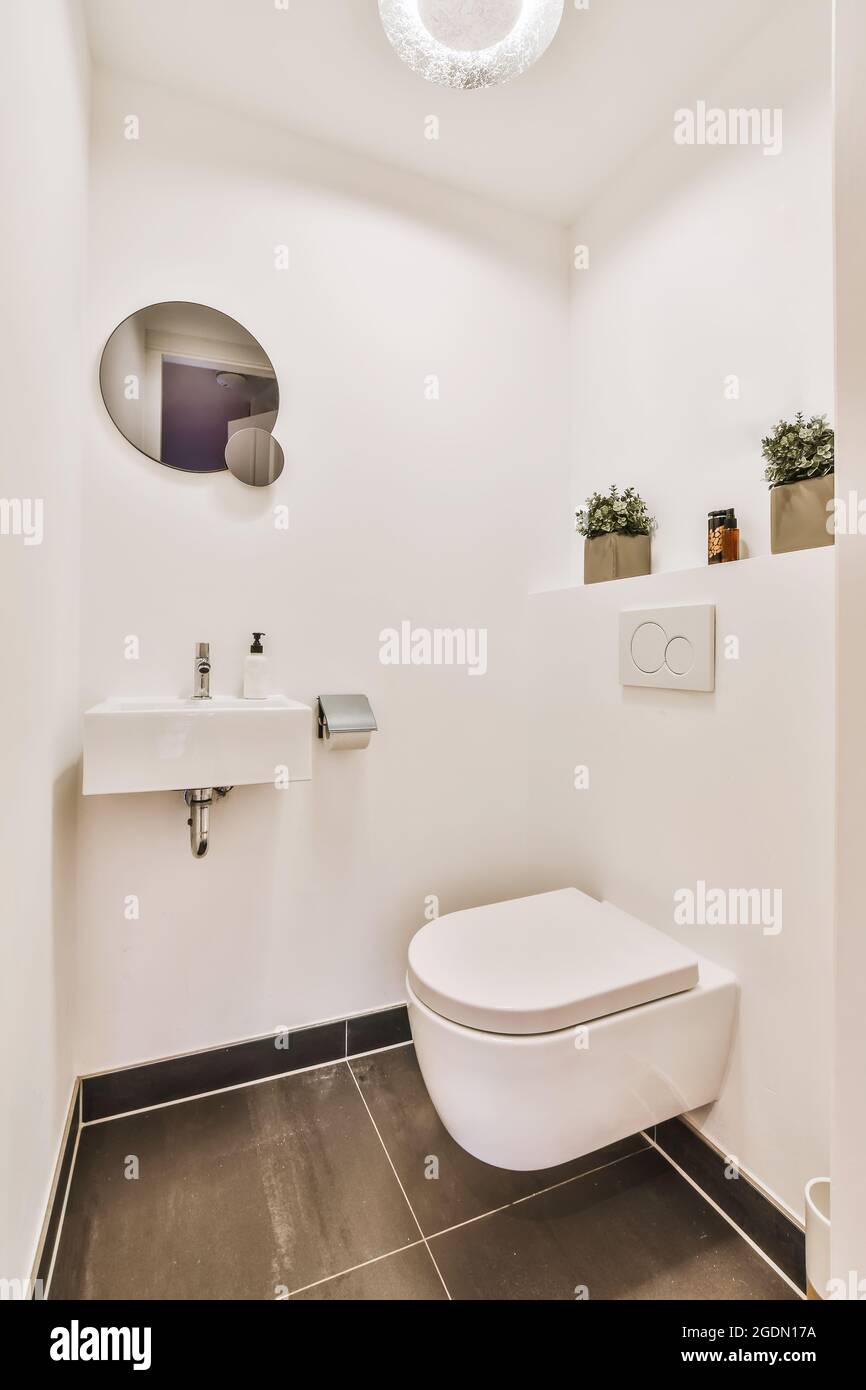 Interior of small clean washroom in miniature style Stock Photo - Alamy