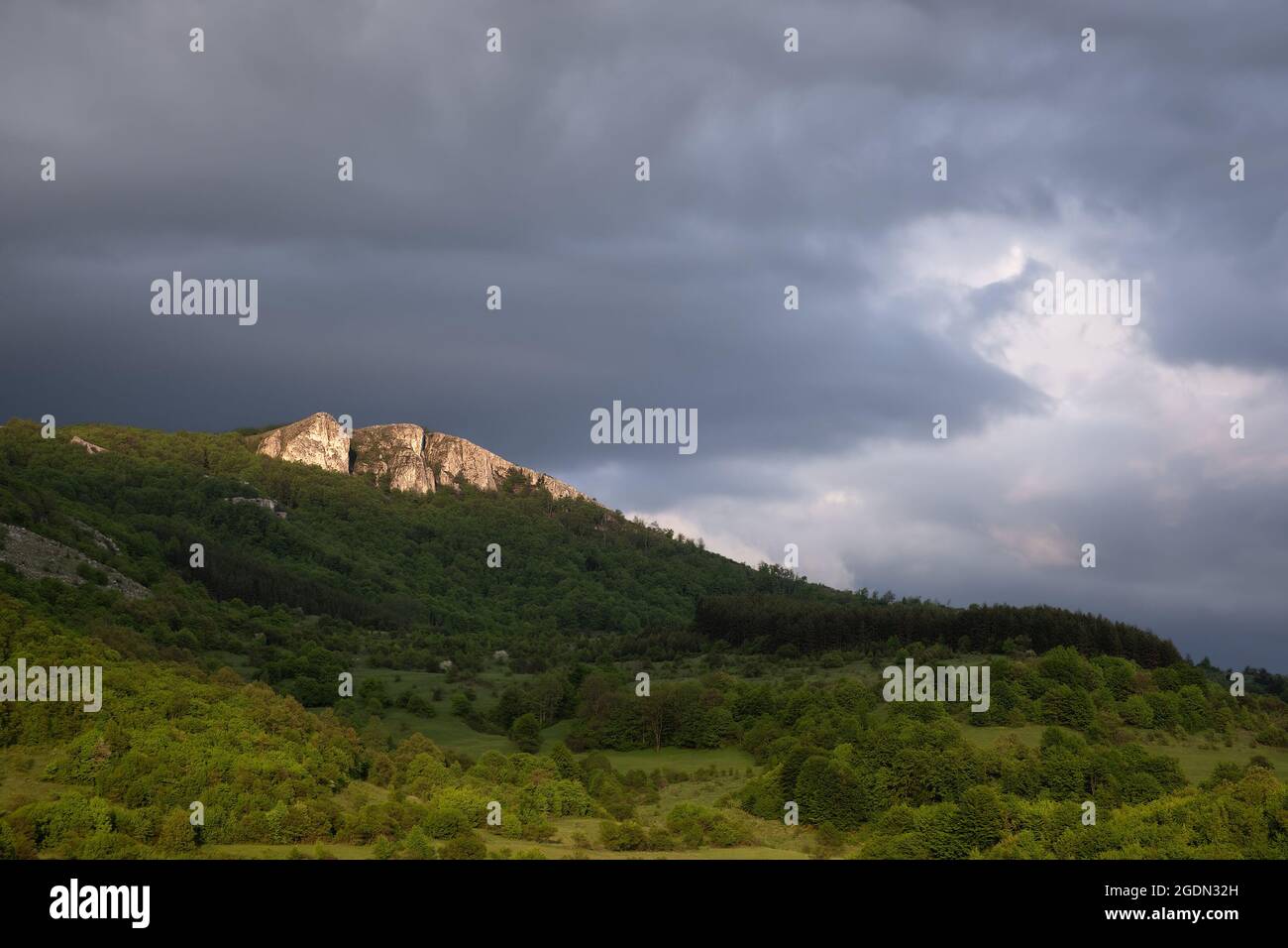 Great, soft light on a pointy, rocky mountain peak and landscape ...